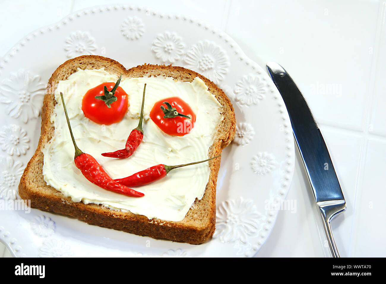 Food arranged into a smiley face on sandwich Stock Photo - Alamy