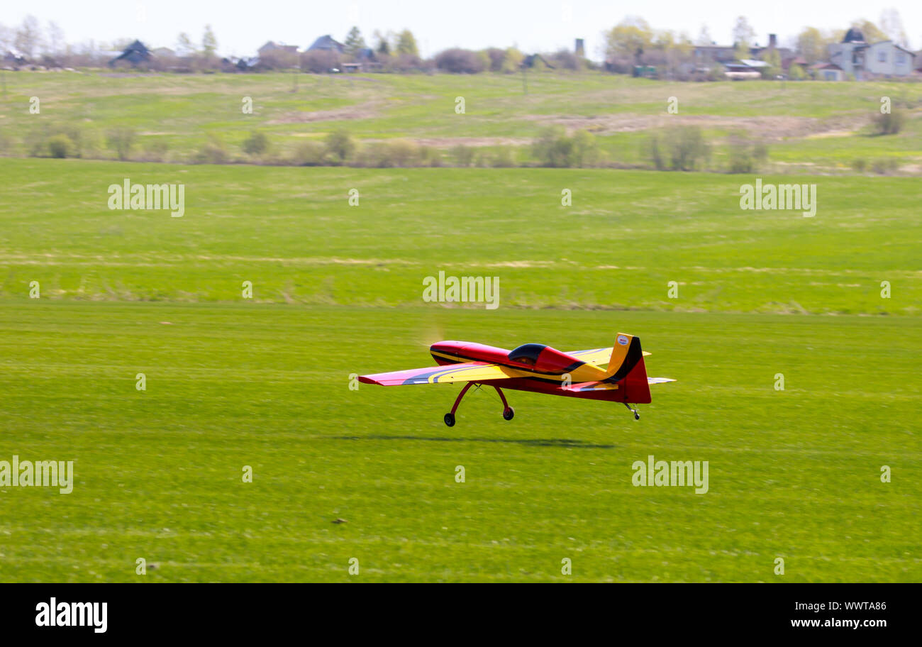 RC model airplane lands on the grass field Stock Photo - Alamy