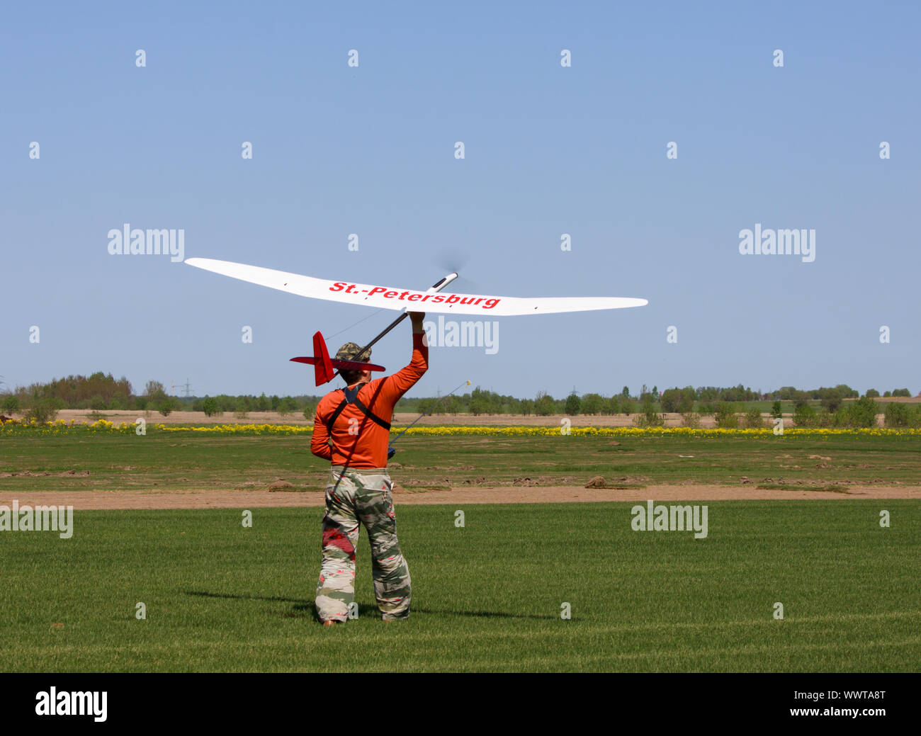 Man launches into the sky RC glider Stock Photo - Alamy