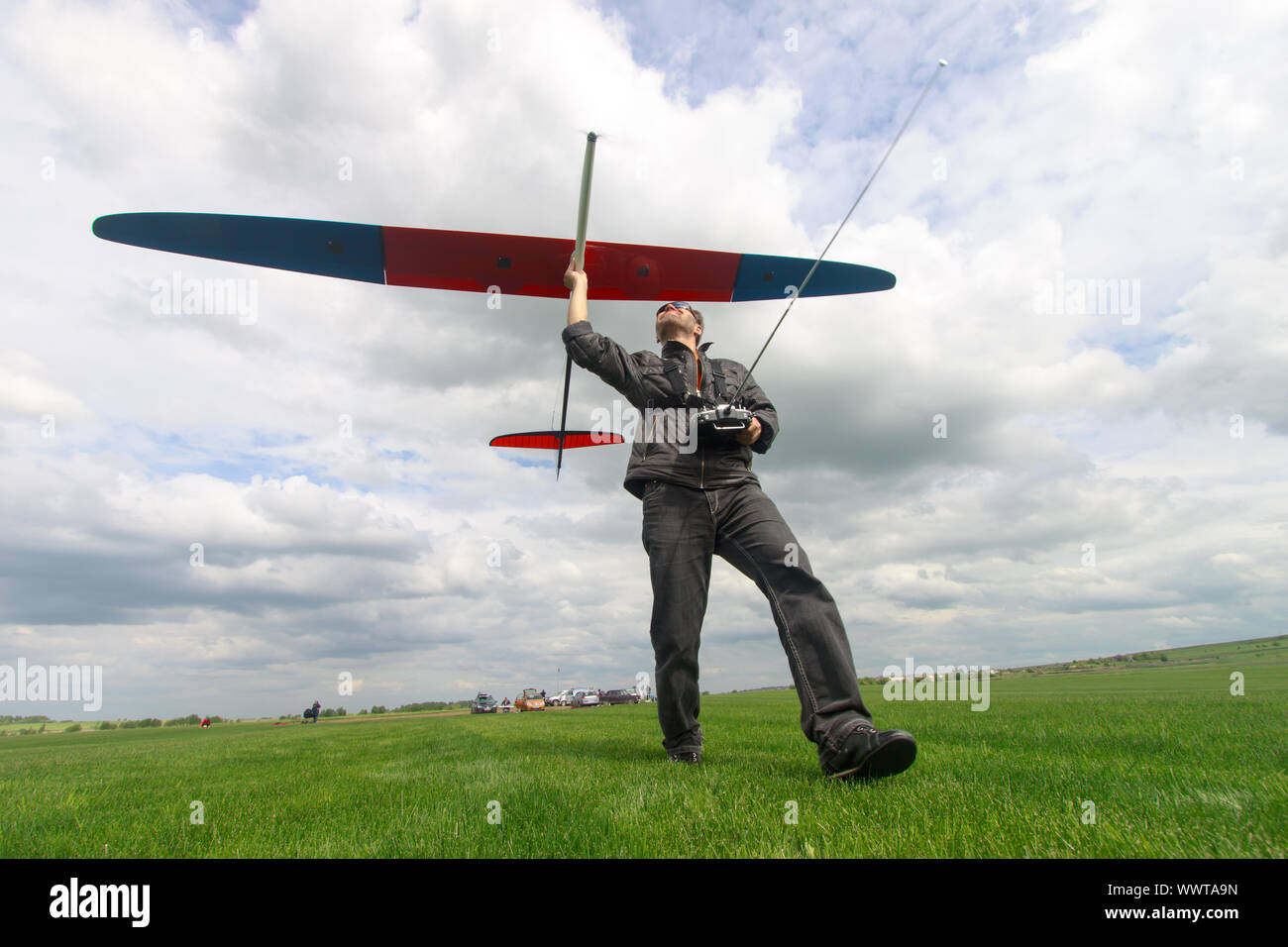 Man launches into the sky RC glider Stock Photo - Alamy