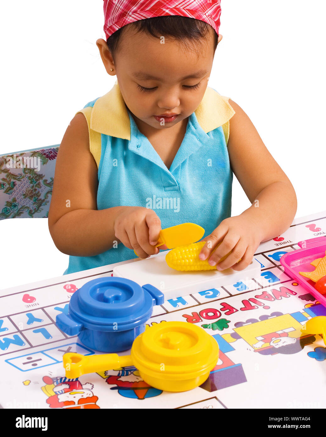 Child having fun playing with plastic kitchen utensils Stock Photo - Alamy