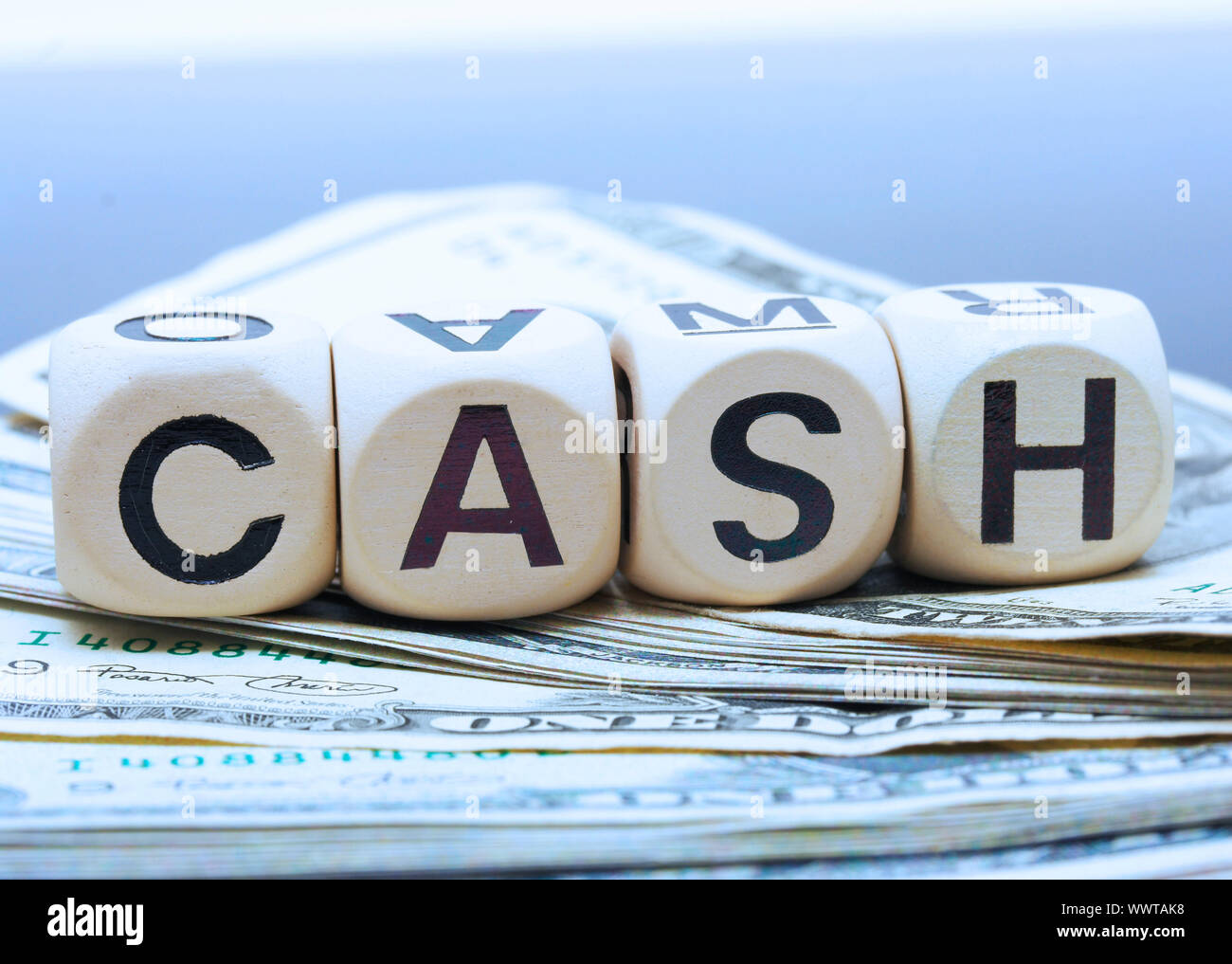 Dollar Bills On The Table With The Word Cash Stock Photo - Alamy