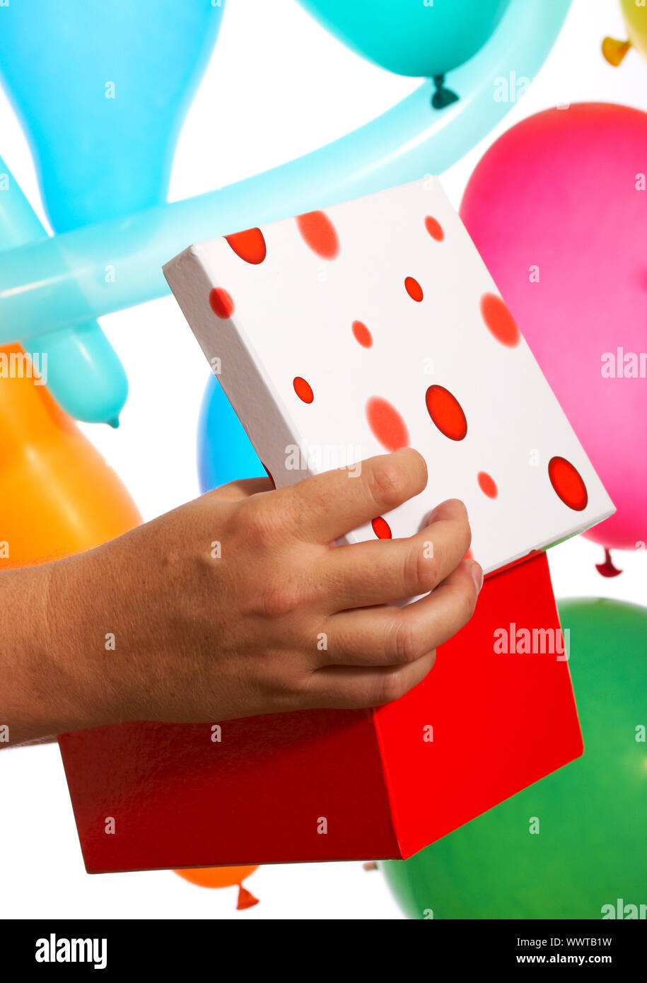 Opening A Birthday Gift At A Party Stock Photo - Alamy
