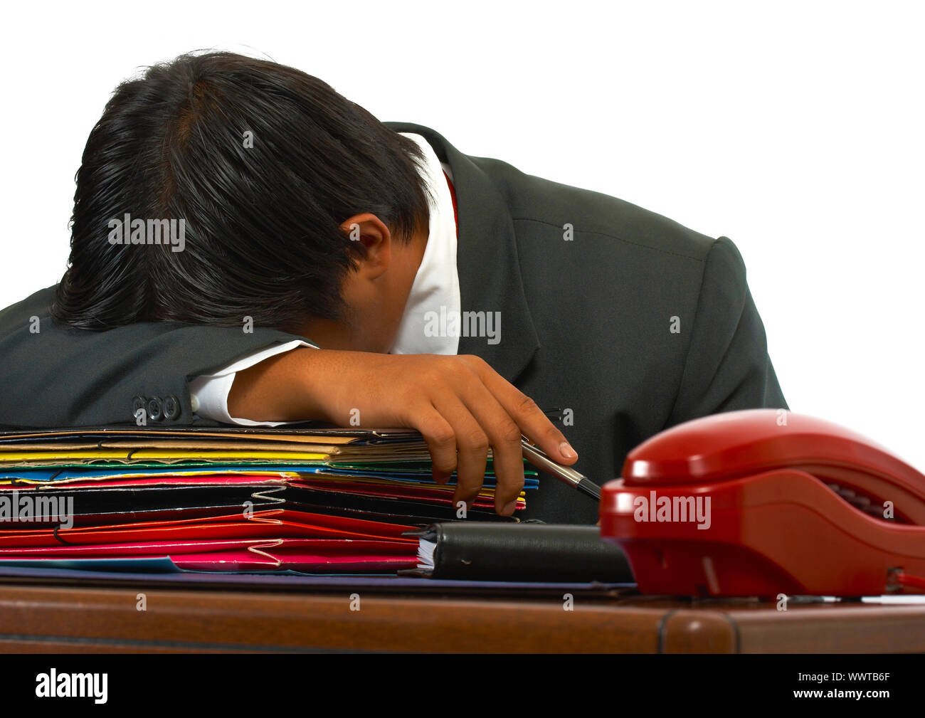 Overloaded Worker Having A Nap On His Desk Stock Photo - Alamy