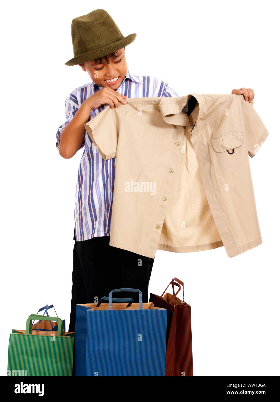 Boy Looking At The Clothes He Has Just Bought For Himself Stock Photo ...