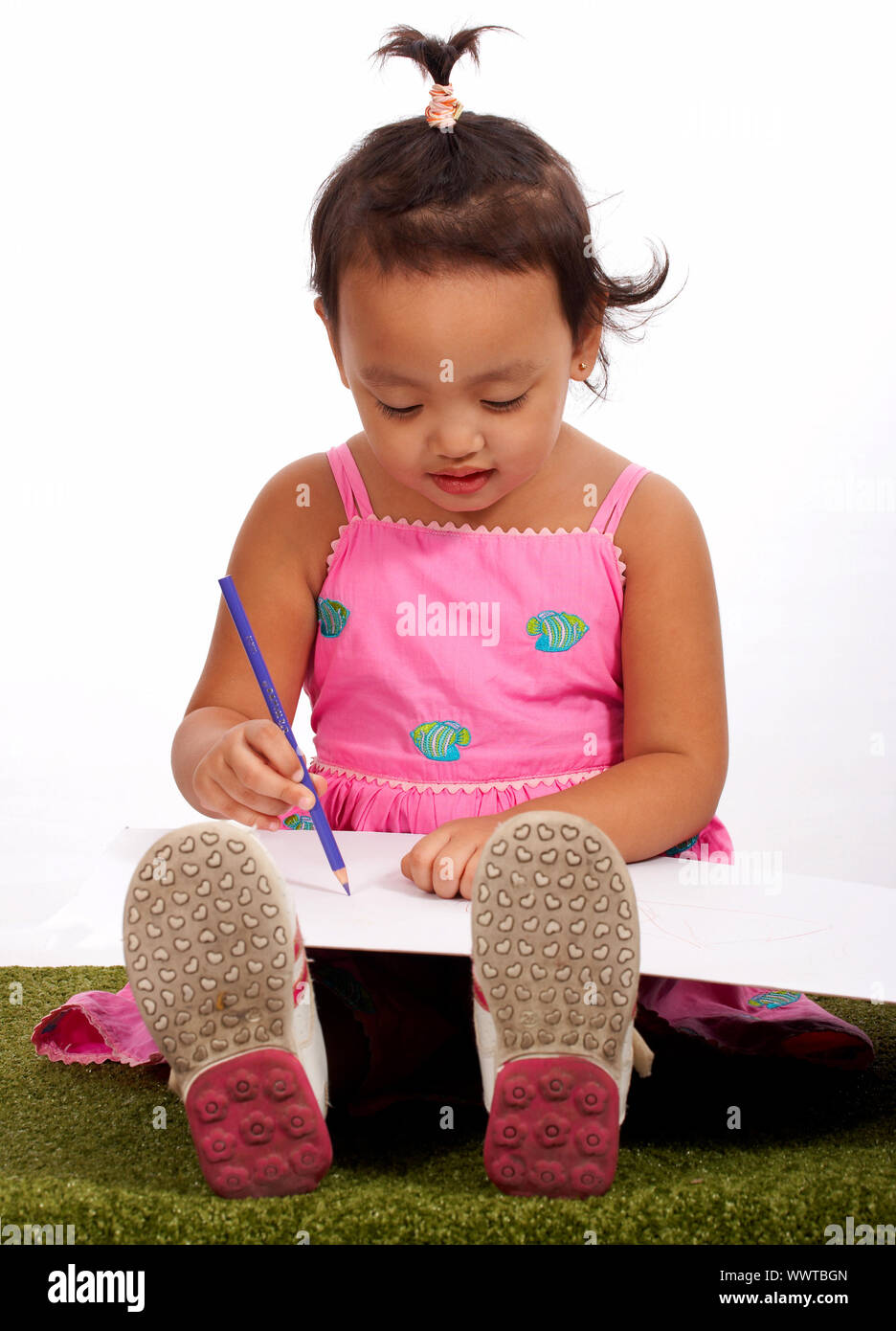 Young Girl Concentrating On Drawing In A Sketch Book Stock Photo - Alamy