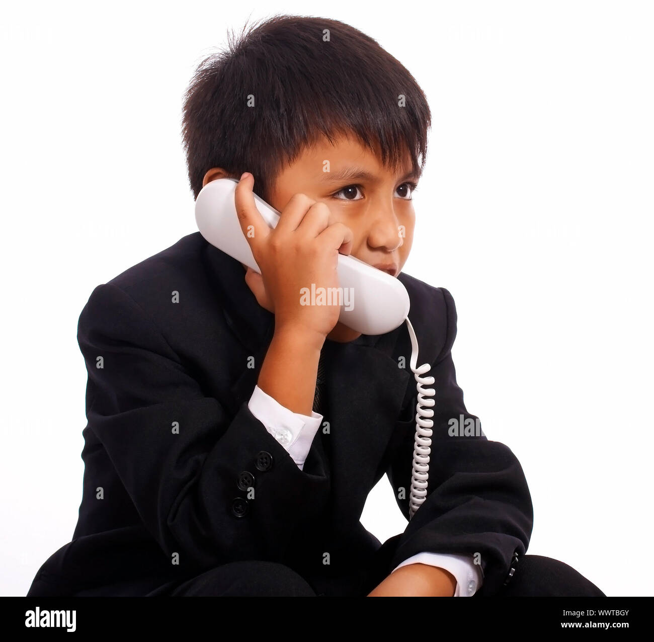 Young Boy In A Suit Having A Chat On The Phone Stock Photo - Alamy