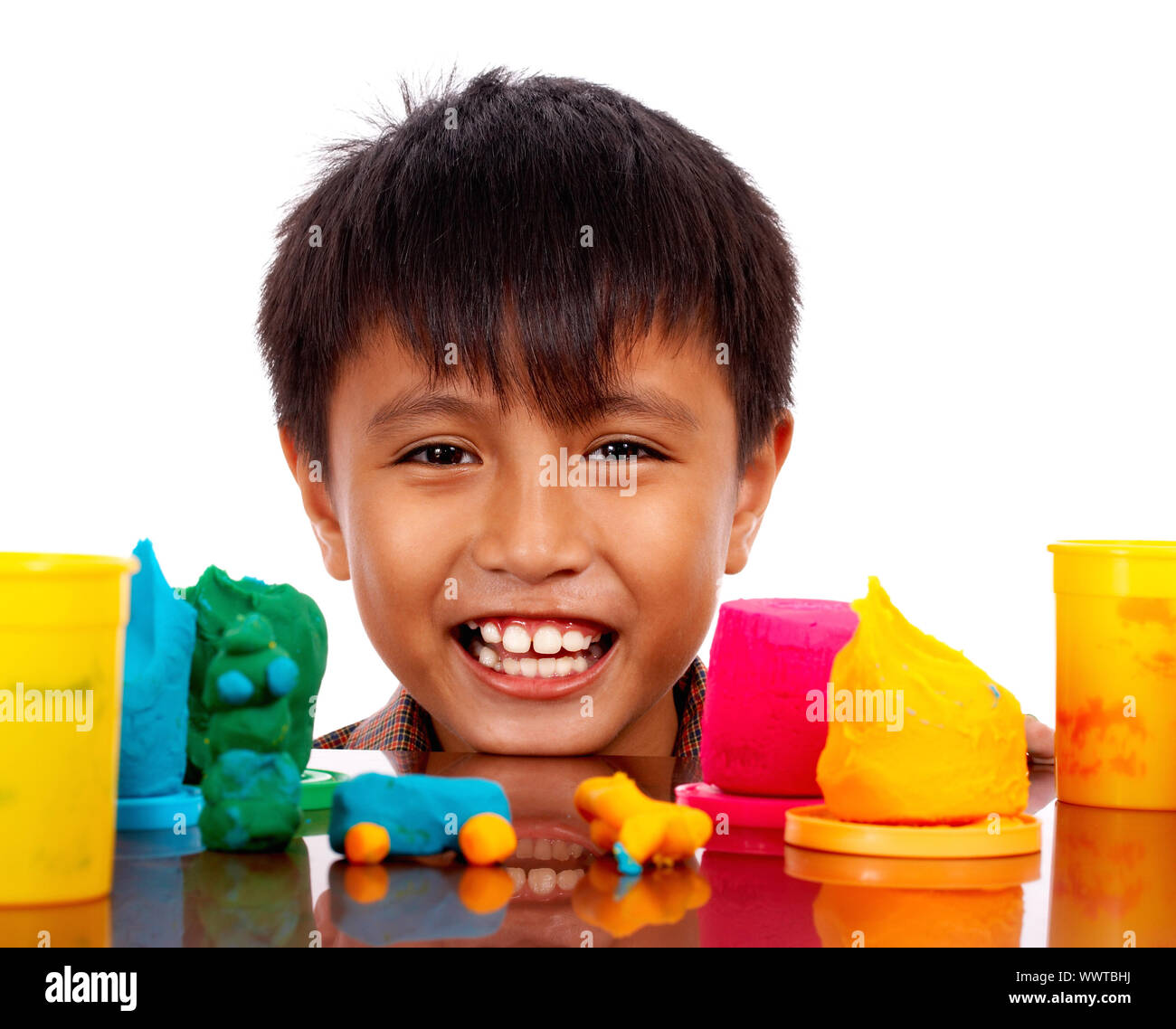 Boy Having Great Fun Making Things From Colored Dough Stock Photo - Alamy