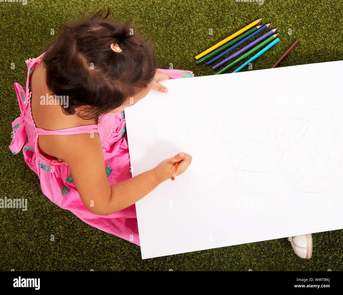 Little Girl Concentrating On Drawing A Picture With Multicolored ...