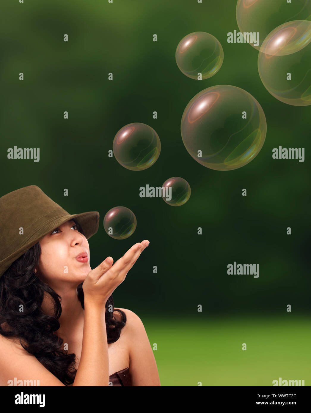 Happy Girl Making A Wish And Making Bubbles Stock Photo - Alamy