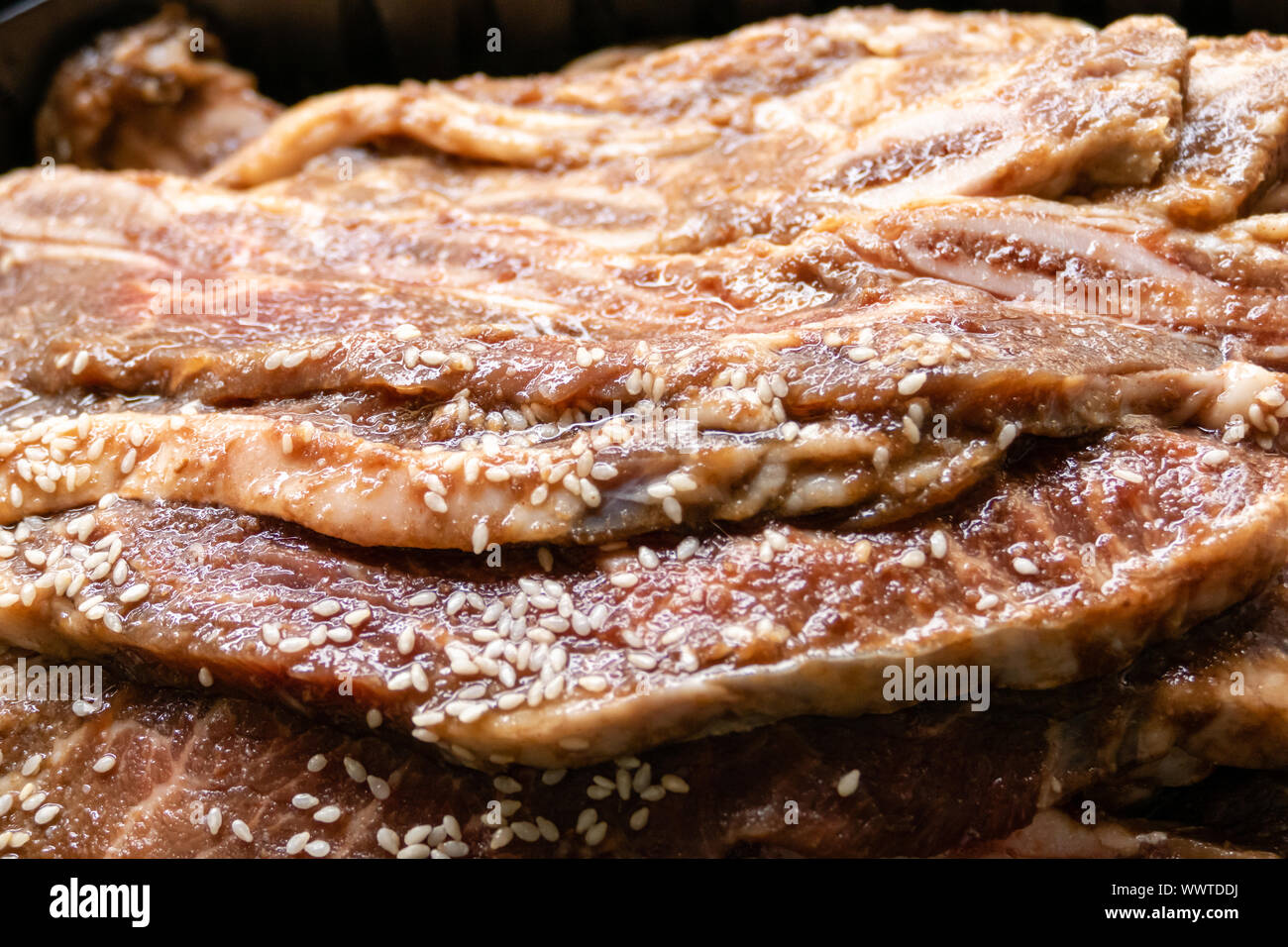 Bowl with stack of raw beef rib steaks Stock Photo - Alamy