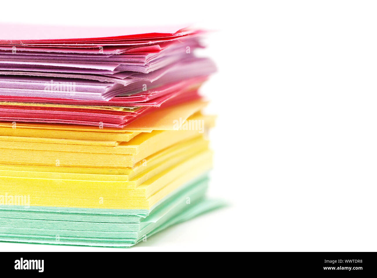 Batch of assorted color paper over white background Stock Photo - Alamy