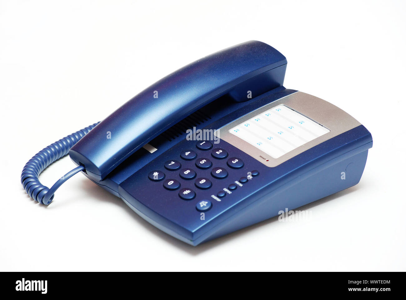 blue office telephone on a white background Stock Photo - Alamy