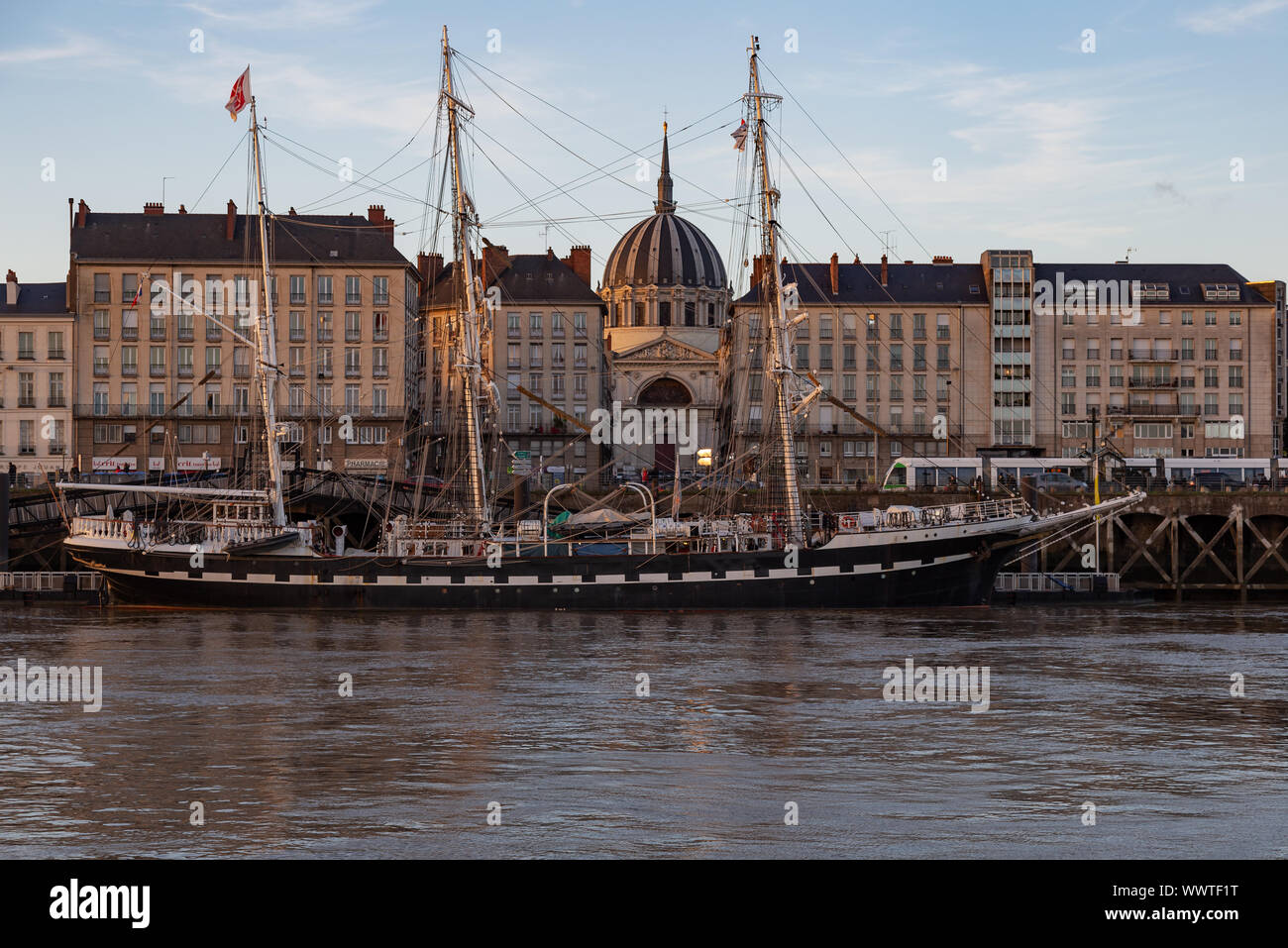 The famous Nantes harbor with a ship shot at sunset Stock Photo - Alamy