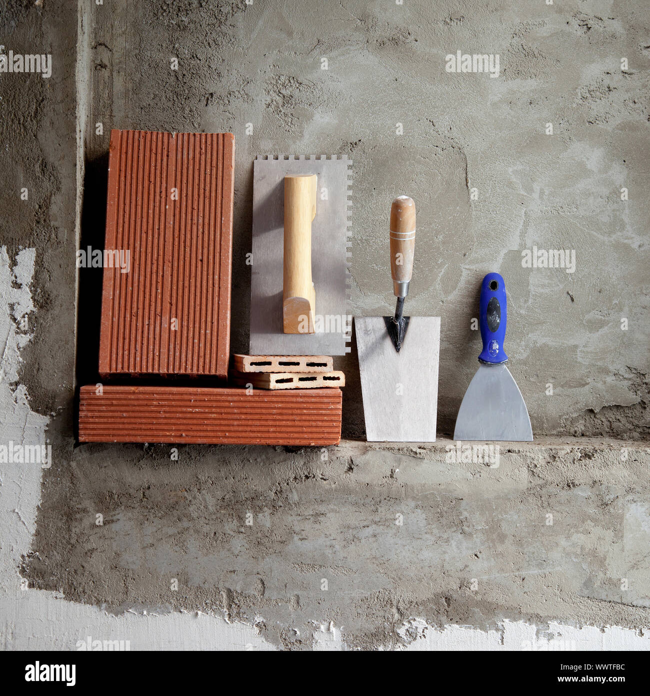 construction stainless steel trowel tools and bricks on cement mortar ...