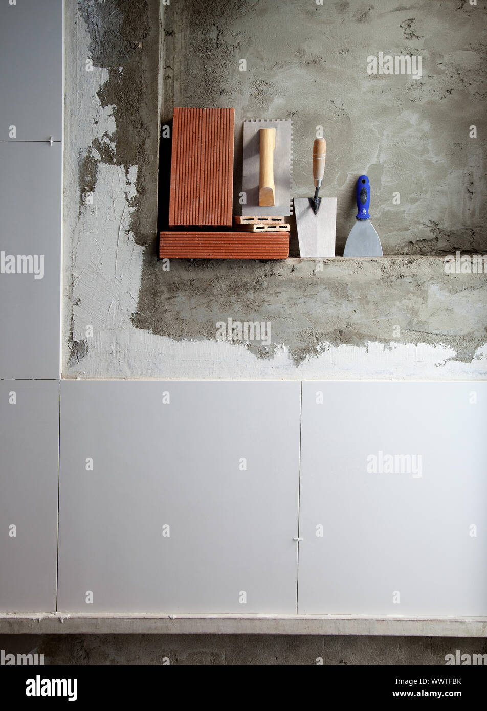 construction stainless steel trowel tools and bricks on cement mortar ...