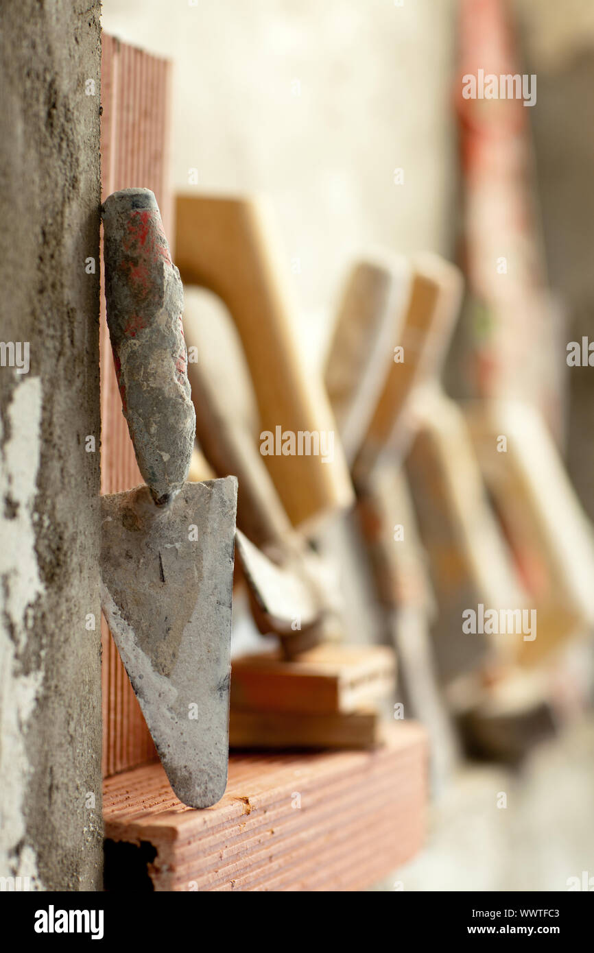 Construction mason cement mortar tools in a row Stock Photo - Alamy