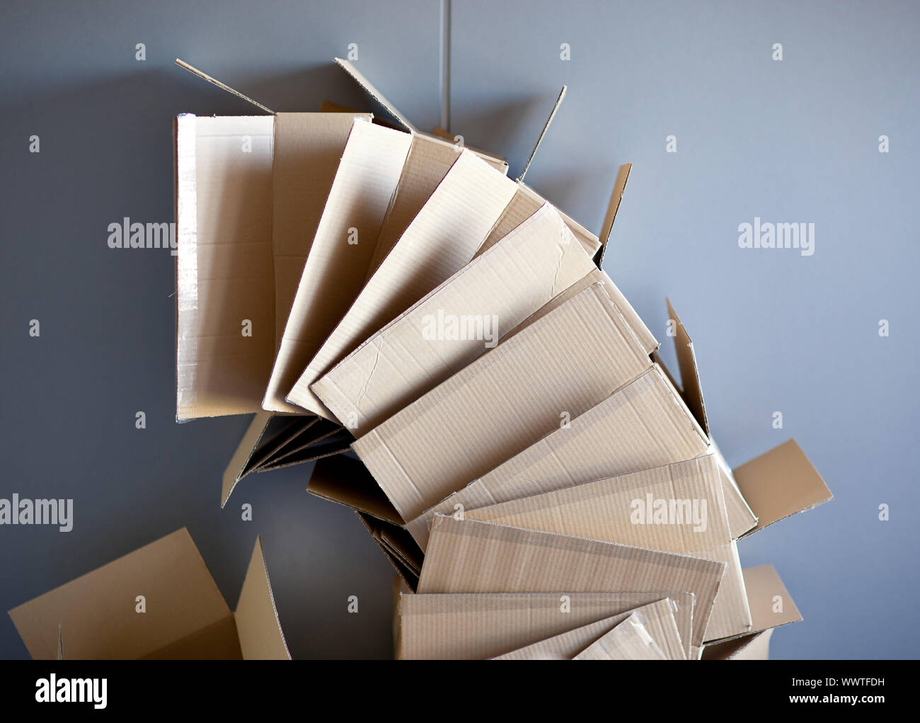 carton open boxes stacked on curved circle shape on gray wall Stock ...