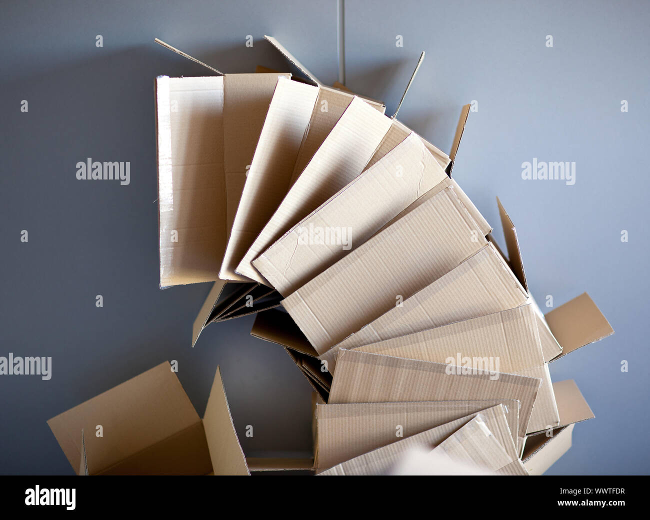 carton open boxes stacked on curved circle shape on gray wall Stock ...