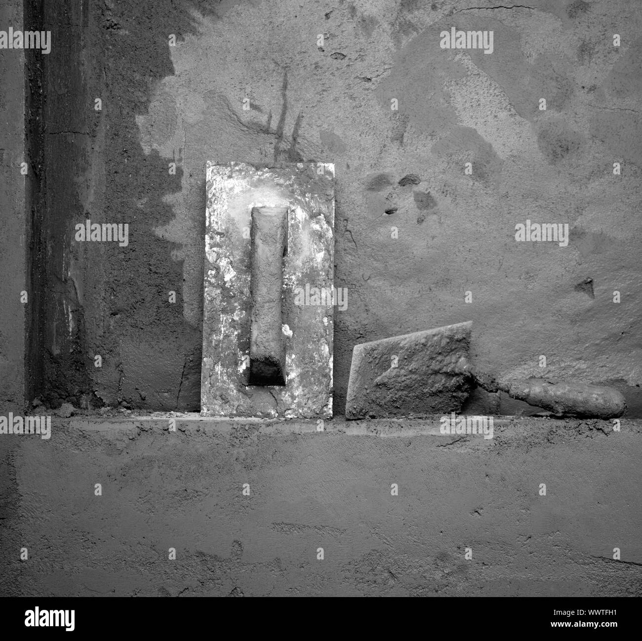 dirty grunge cement trowel hand tools on fresh mortar wall Stock Photo ...