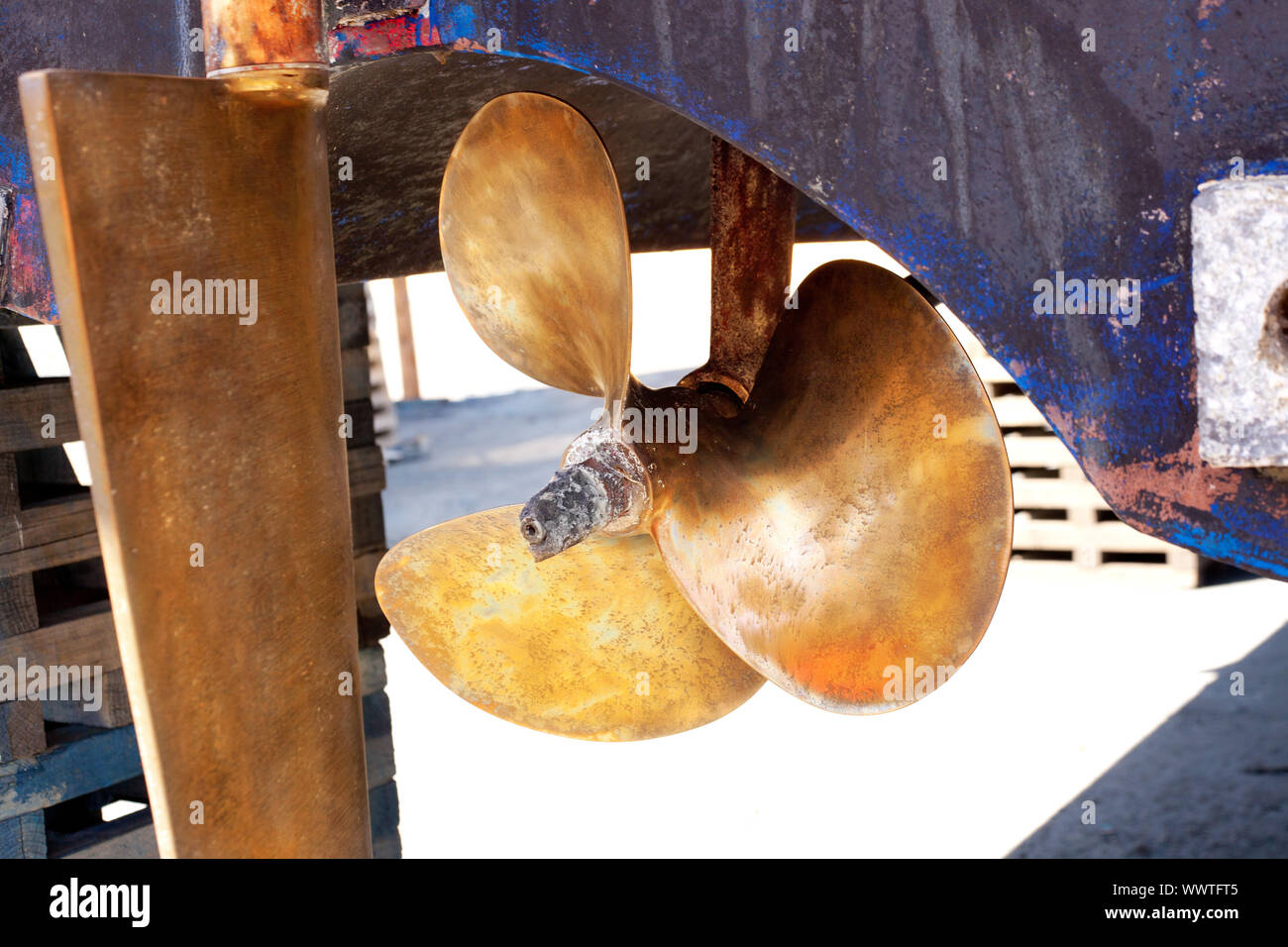 brass boat propeller and steering in beached ship Stock Photo - Alamy