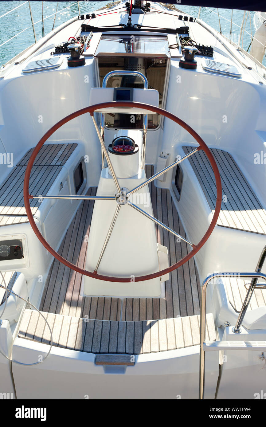 boat stern with big steering wheel and sailboat stern deck Stock Photo ...