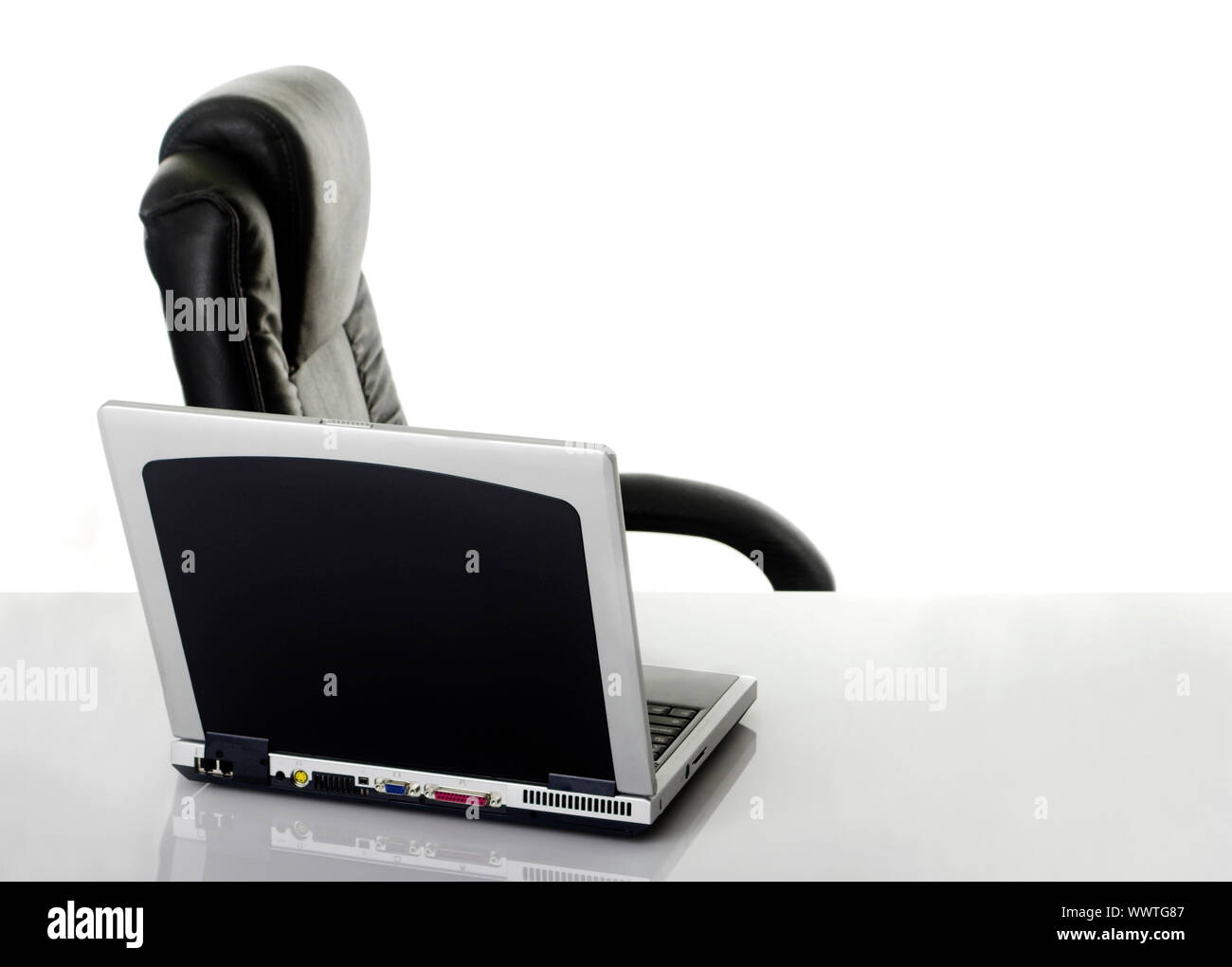 Work office with a chair and laptop over the table Stock Photo - Alamy