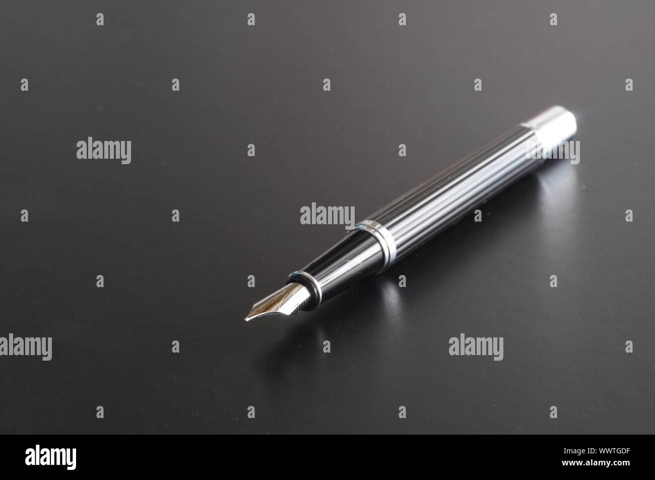 pen showing communication contact us or mail concept on black ...