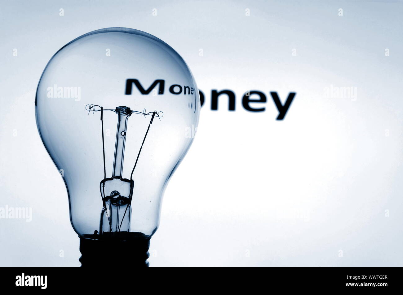 bulb and money text showing concept of financial success Stock Photo ...