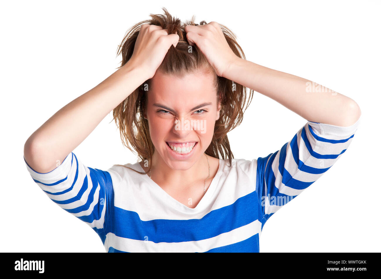 Frustrated and angry woman with hands in her hair pulling Stock Photo ...