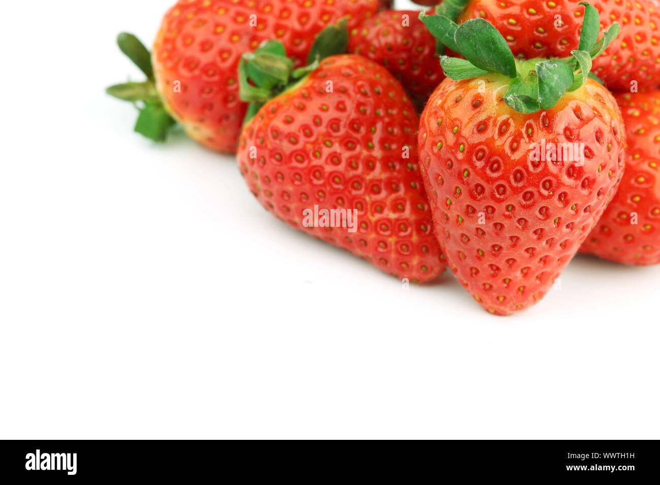 strawberry pile on white background Stock Photo - Alamy