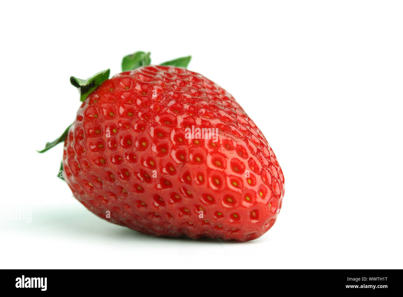 one strawberry on white background Stock Photo - Alamy