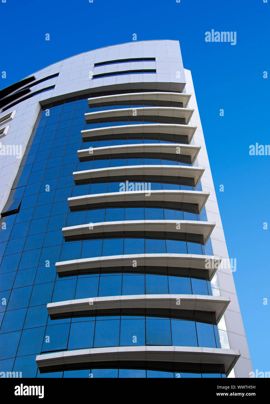 Picture of a Futuristic glass building with reflections Stock Photo - Alamy