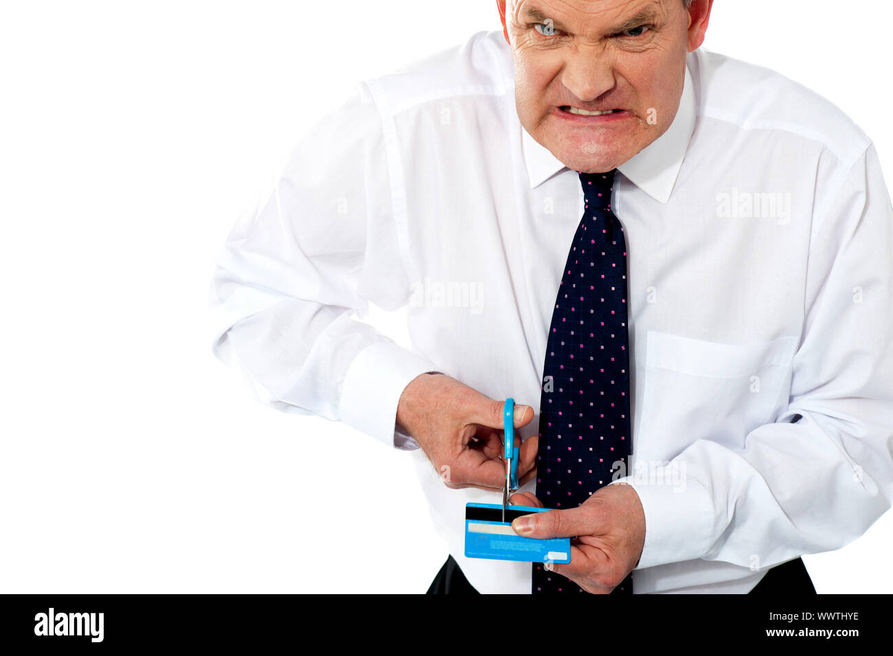 Frustrated businessman cutting his credit card. Extremely disappointed ...