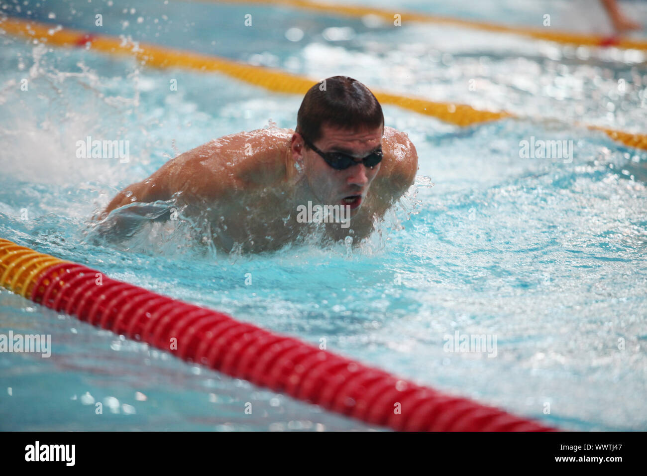 swimmer in motion in a spray of water Stock Photo - Alamy