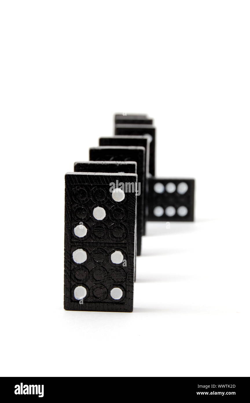 row of dominoes including a special domino stone isolated on white ...