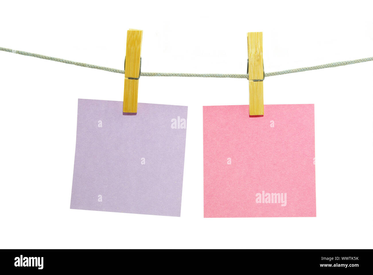 note paper blanks on rope isolated on white Stock Photo - Alamy