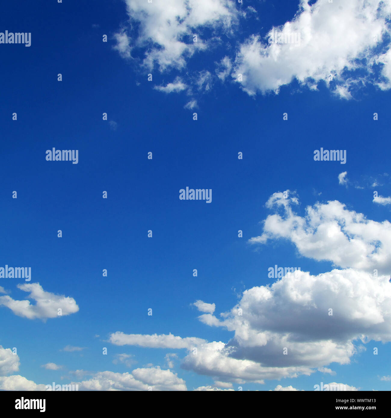 Blue sky background with tiny clouds Stock Photo - Alamy