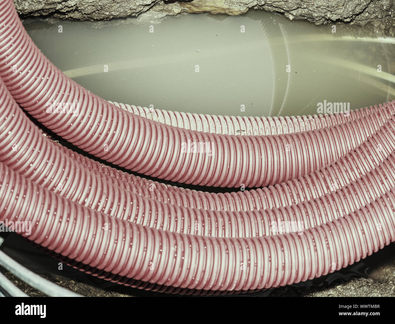 Steel wire in protective lplastipipe under ground. Construction Area ...