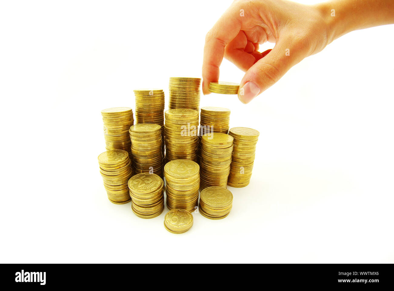 Hand put coin to money staircase isolated on white background Stock ...