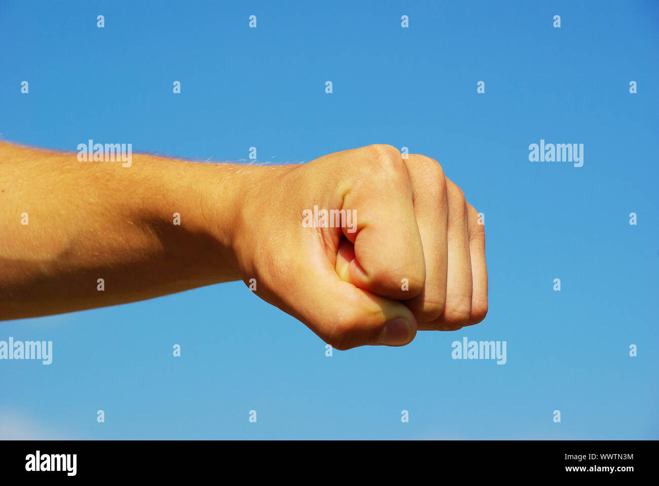 clenched fist in the air Stock Photo - Alamy