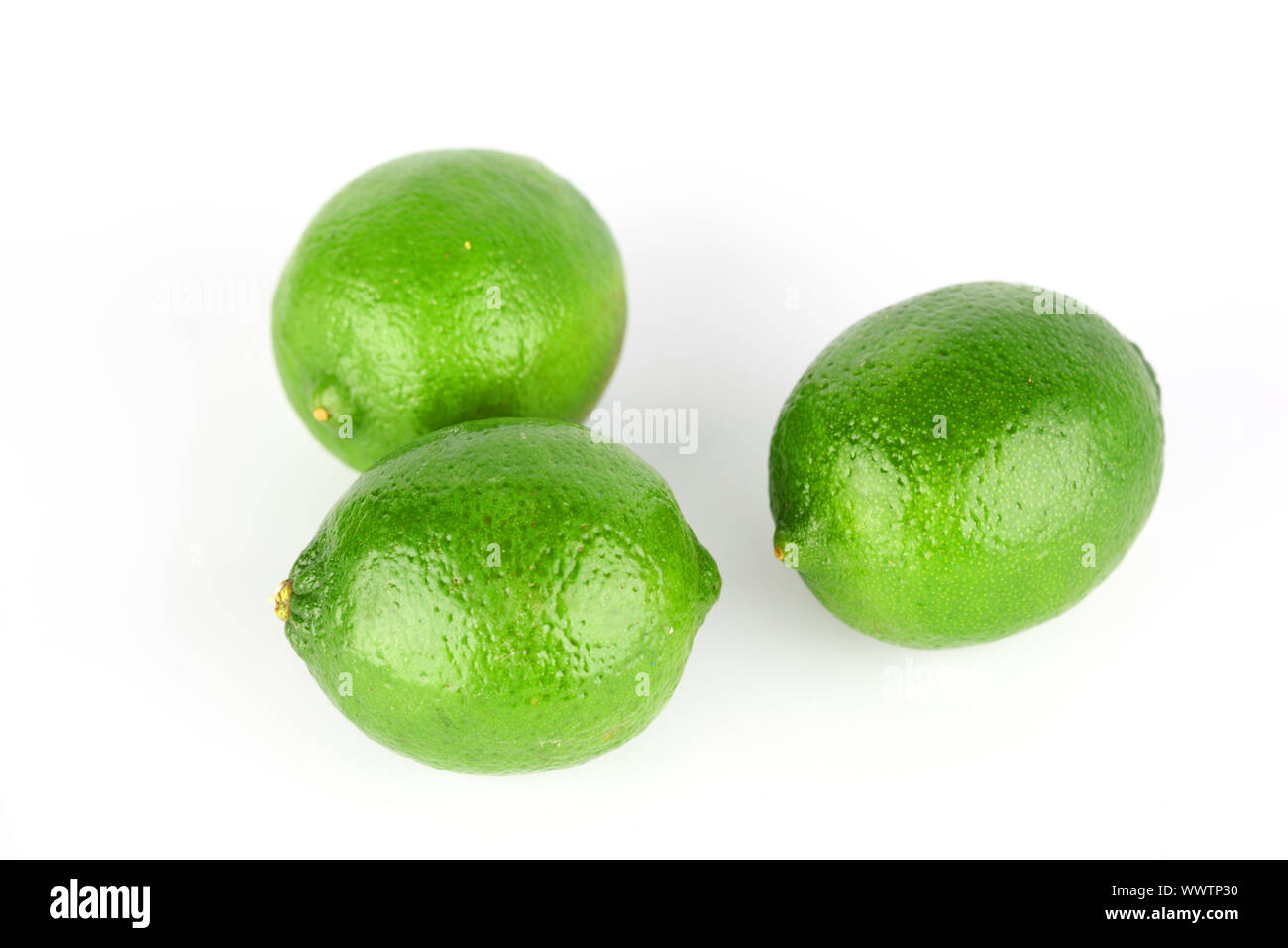 lime pile isolated on white background Stock Photo - Alamy