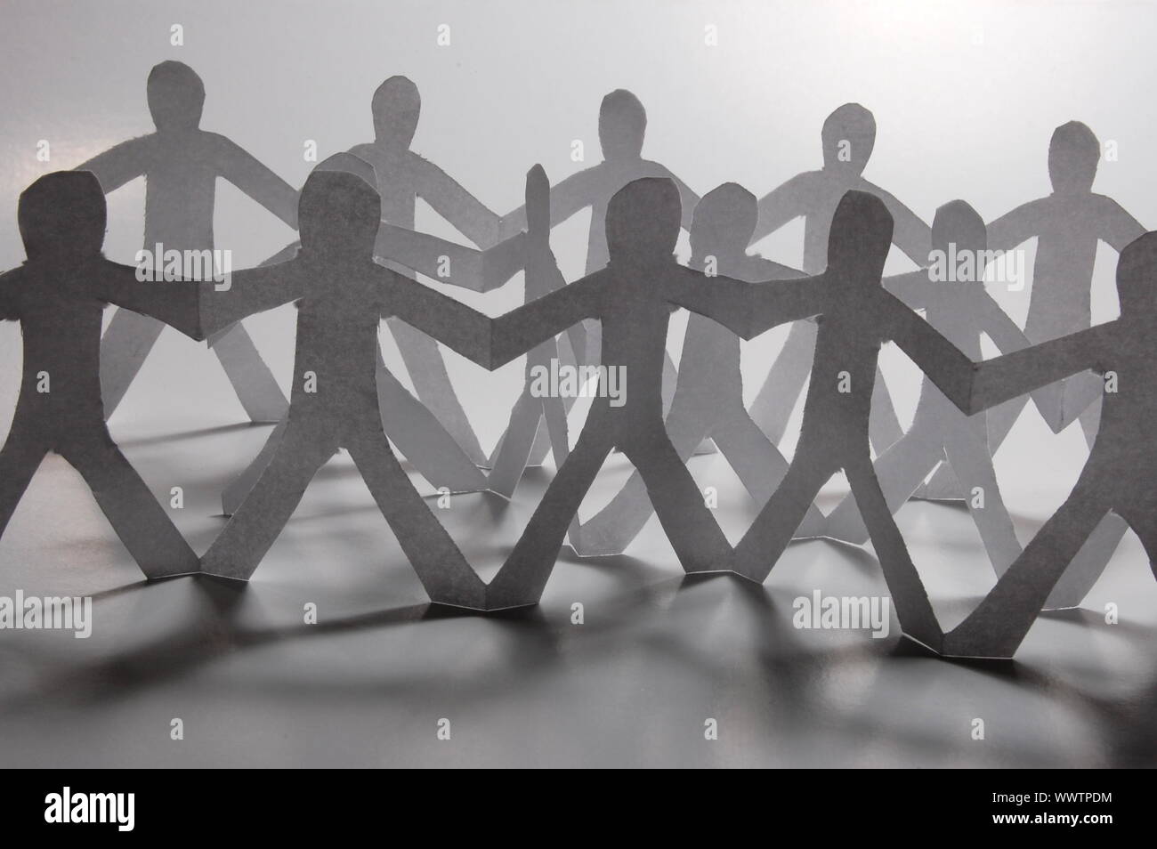 paper people doing teamwork in their business Stock Photo - Alamy