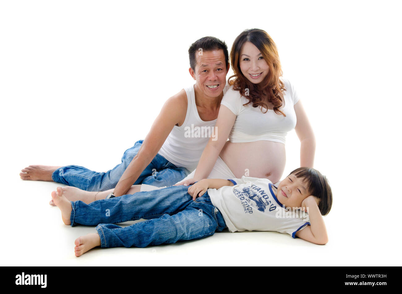 Asian family portrait sitting on floor Stock Photo - Alamy