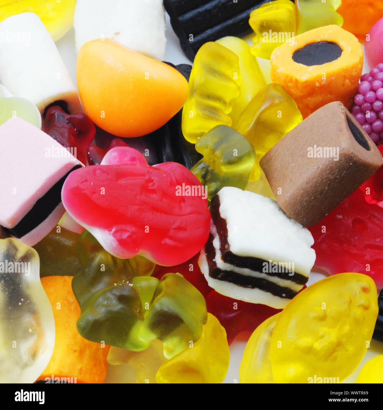 unhealthy candy background or texture in vibrant colors Stock Photo - Alamy