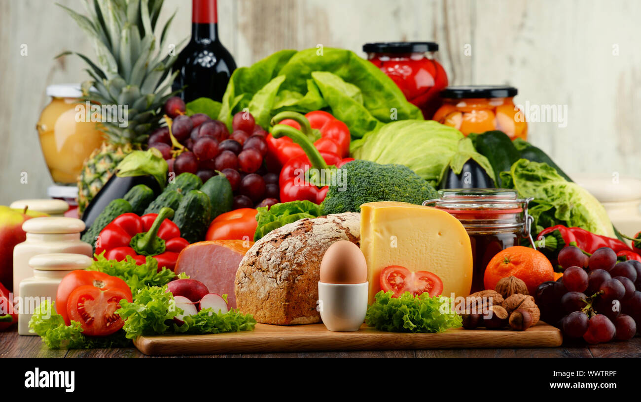 Variety of organic food including vegetables fruit bread dairy and meat ...
