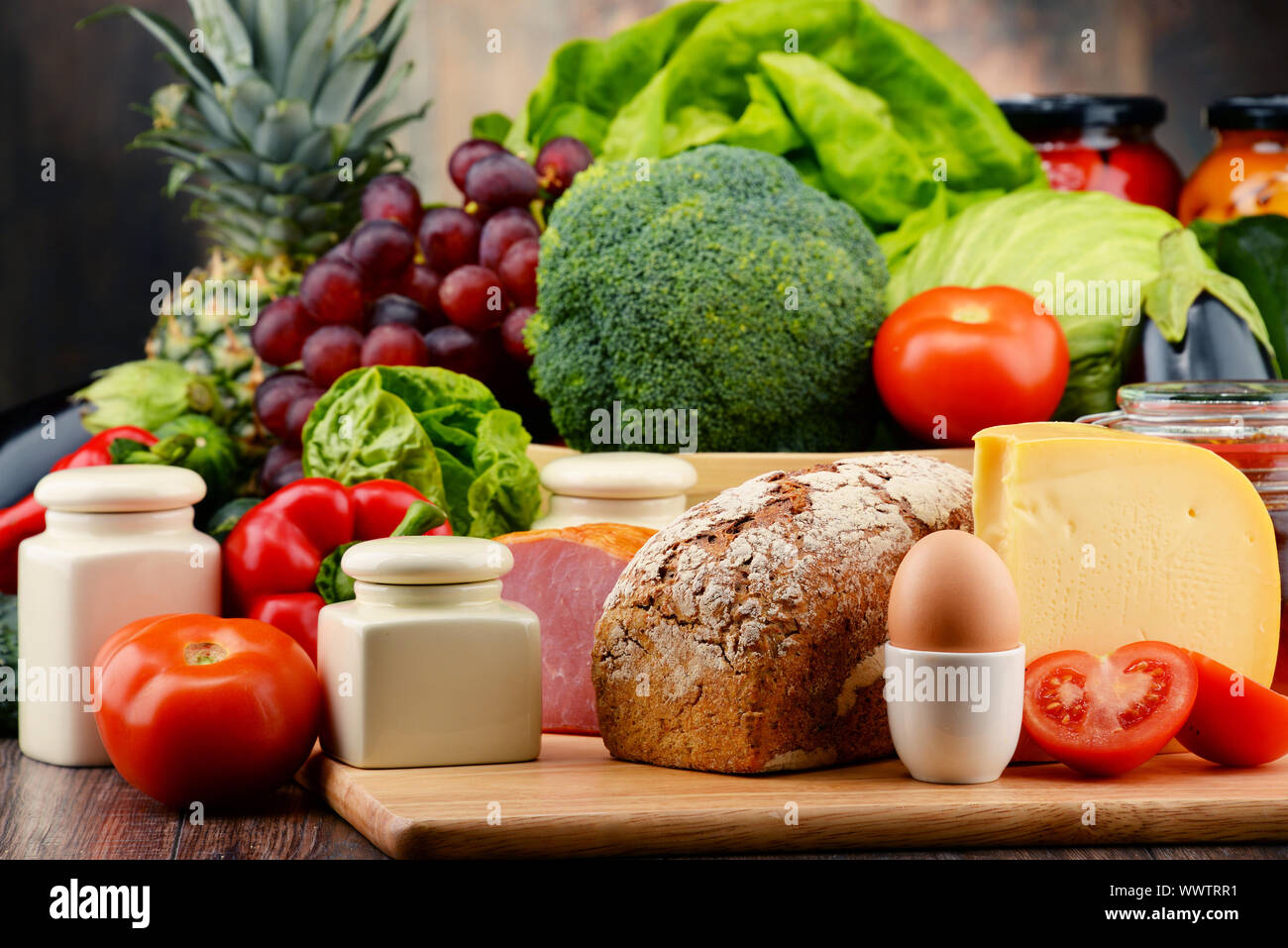 Variety of organic food including vegetables fruit bread dairy and meat ...