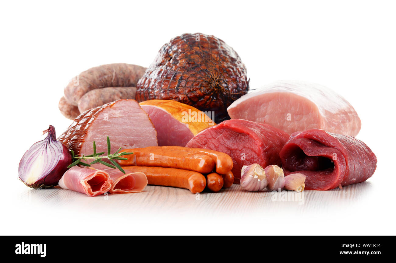 Assorted meat products including ham and sausages isolated on white ...