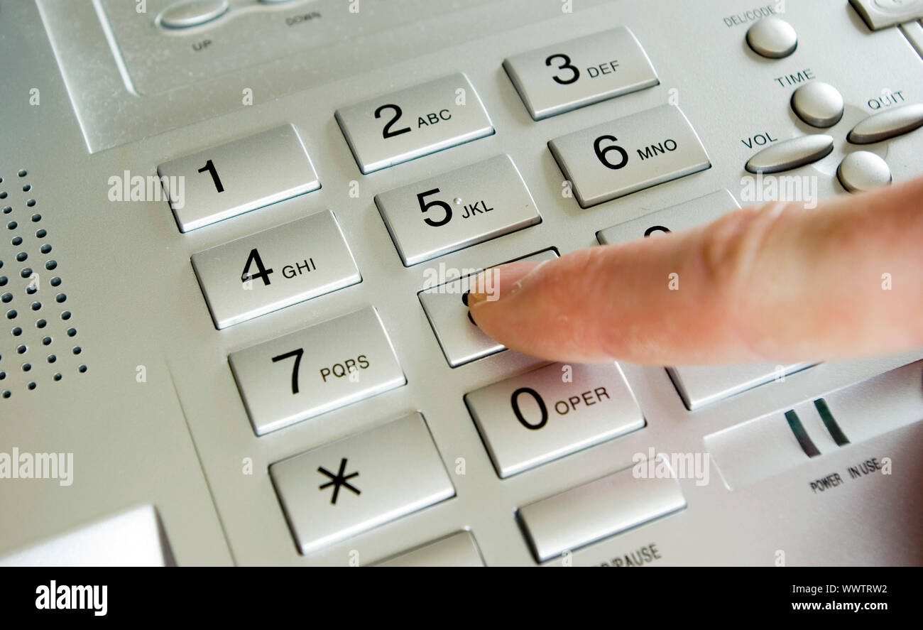 finger with grey telephone keypad Stock Photo - Alamy