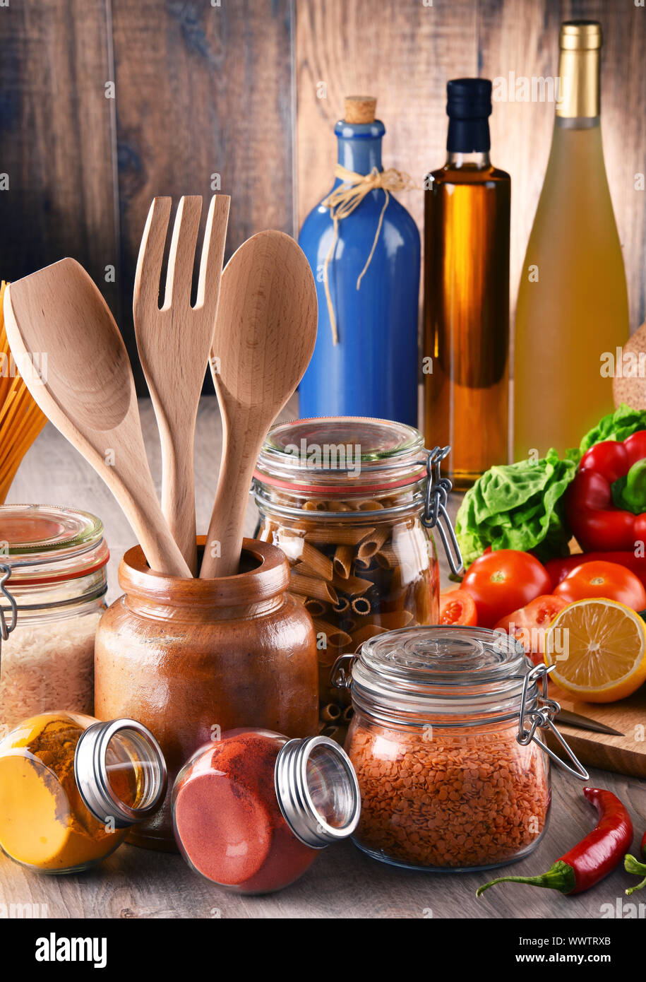 Composition with assorted food products and kitchen utensils on the ...